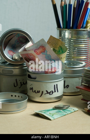 Money in containers, close-up Stock Photo - Alamy