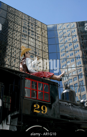 ARCHITECTURE cowboy sitting on a steam engine at the Calgary Stampede ...