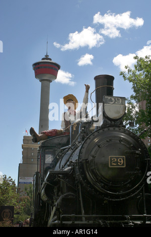 ARCHITECTURE cowboy sitting on a steam engine at the Calgary Stampede ...