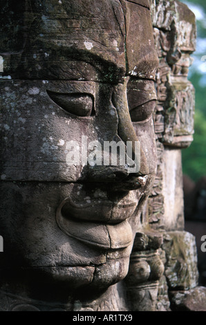 Stone face at the Bayon Temple the Tempel Ruins of Angkor Thom in the ...