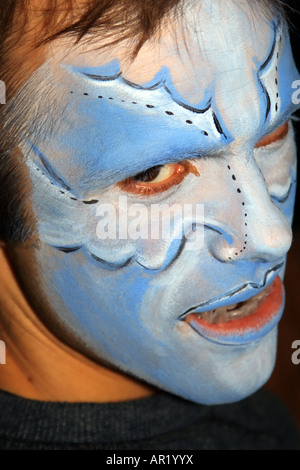 Evil look of a man with painted face Stock Photo - Alamy