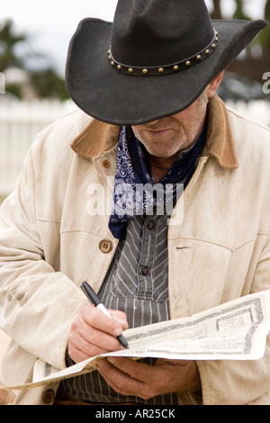 A man dressed in traditional cowboy attire at the Calgary Stampede ...