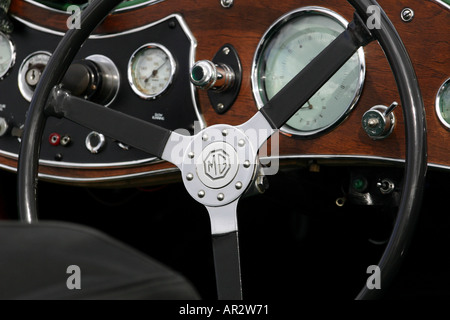 Steering wheel and dashboard of an MG TD sports car from the early ...