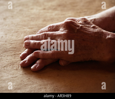 An elderly woman's hands overlapping contentedly Stock Photo - Alamy