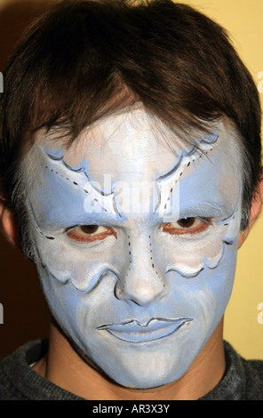 Evil look of a man with painted face Stock Photo - Alamy