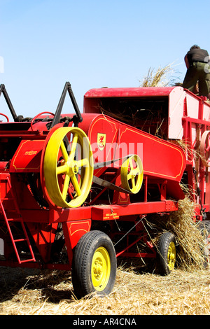 Straw baler driven by steam traction engine Stock Photo - Alamy
