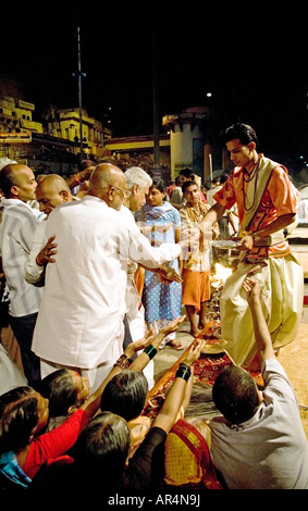 Brahman giving prasad blessing. Ganga aarti ceremony. Dasaswamedh Ghat ...
