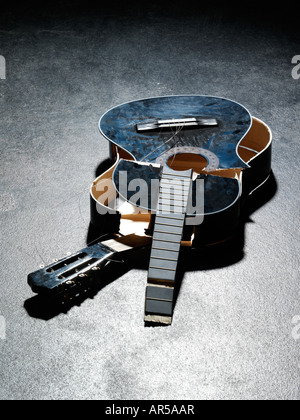 Smashed acoustic guitar Stock Photo - Alamy