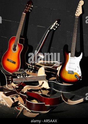 A smashed and broken acoustic guitar Stock Photo - Alamy