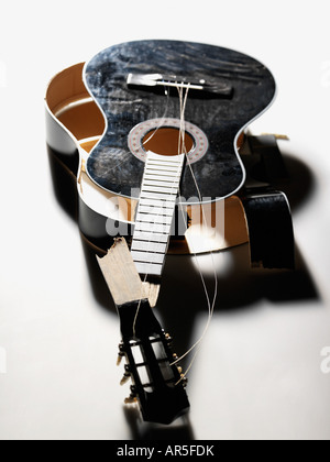A smashed and broken acoustic guitar Stock Photo - Alamy