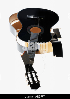 A smashed and broken acoustic guitar Stock Photo - Alamy