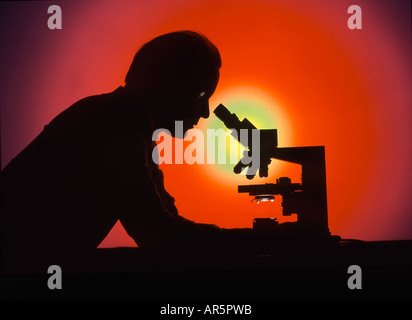 Forensic Science in Lab. Forensic Scientist examining textile for blood ...