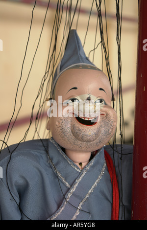Happy monk Chinese puppet performance on stage Stock Photo - Alamy