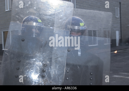 Metropolitan police public order training instructors demonstrating ...