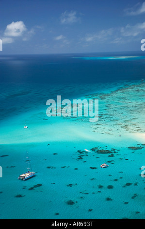 Aerial view of Upolu Cay Great Barrier Reef rising out of the Coral Sea ...