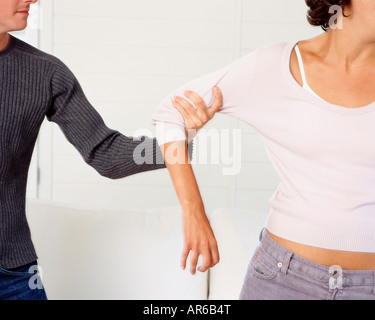 Young man pulling young woman by her arm Stock Photo: 9919461 - Alamy