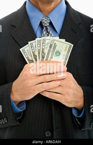 Several twenty dollar cash bills are laid out in neat stack for payment ...