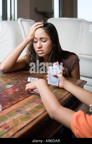 Brother and sister are playing with cards Stock Photo - Alamy