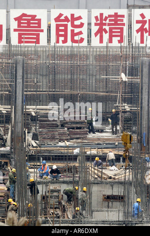 Chinese construction workers concrete the foundation of the Shanghai ...