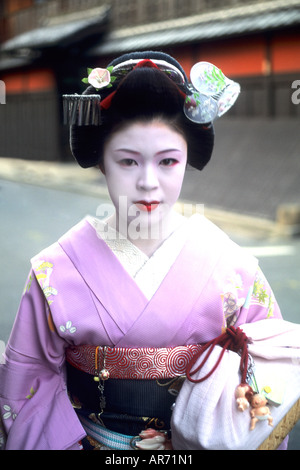 Close-up portrait of Japanese geisha doll in traditional costume ...