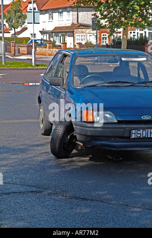Collapsed suspension on car Stock Photo - Alamy