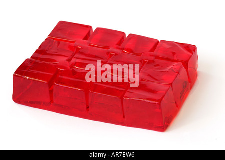 RED JELLY cubes against a white background Stock Photo - Alamy