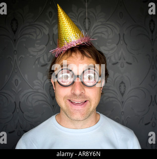 idiot in a party hat Stock Photo - Alamy