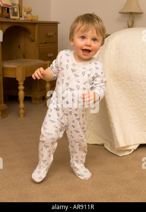 tentative baby walking unsteady naked toddler standing red hair walking ...