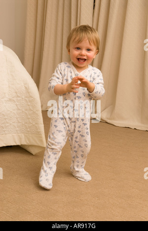 tentative baby walking unsteady naked toddler standing red hair walking ...