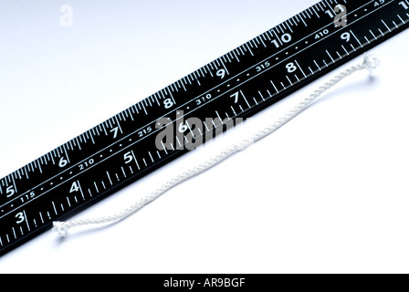 Image of a piece of string being measured against a ruler Stock Photo ...