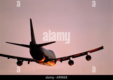 Boeing 747-8 Cargo aircraft cruising at high altitude with long white ...
