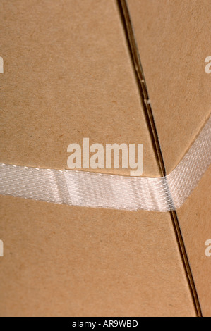 Cardboard with strapping Stock Photo - Alamy
