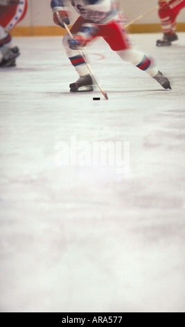 ice hockey player in action kicking with stick Stock Photo - Alamy
