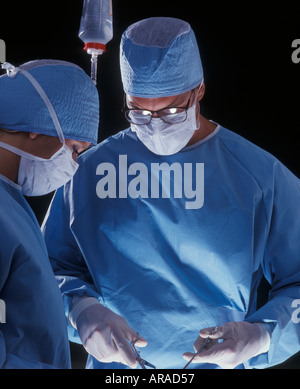 Female surgeon in operation room with reflection in glasses Stock Photo ...