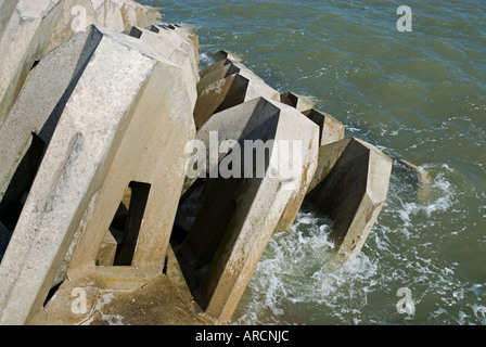 Concrete groynes defenses by the seafront in Clacton-on-Sea, Essex ...
