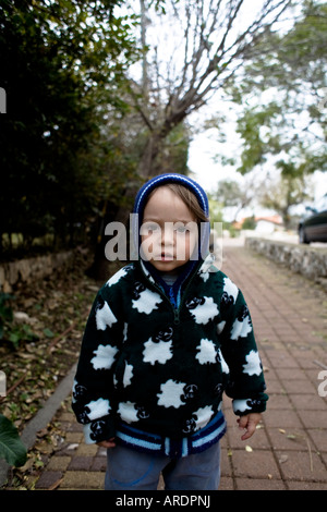 a small kid staring at the camera Stock Photo - Alamy