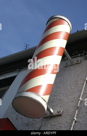 The red and white striped helix of a traditional barbers pole. Fixed to ...