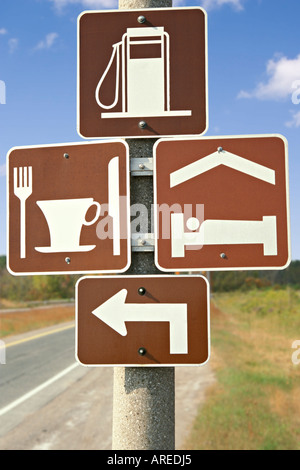 Road sign for gas, food, lodging, and love on a desert road Stock Photo ...