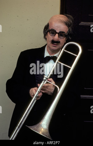 circus performers back stage clown w trombone Stock Photo - Alamy