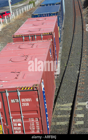 Shipping containers being transported by rail though the British ...