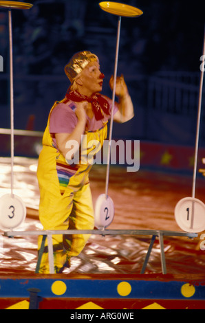 Clown spinning plates Stock Photo - Alamy