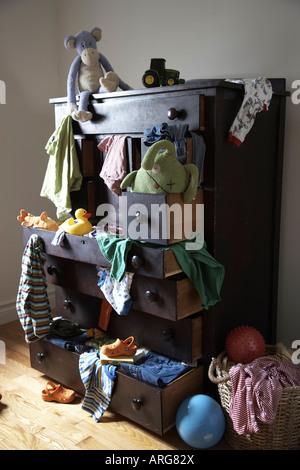 Messy bedroom with clothes scattered Stock Photo - Alamy