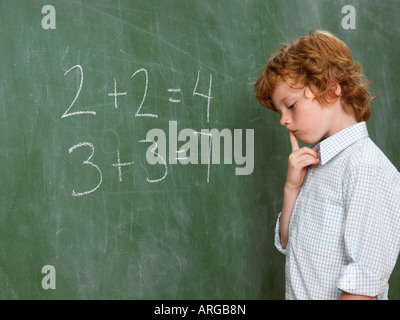 Boy Thinking About Math Answer Stock Photo - Alamy