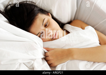 Close-up of sick pretty girl drinking water from glass Stock Photo - Alamy