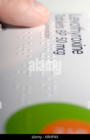 Reading braille on a medicine prescription packaging Stock Photo - Alamy