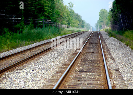 Two sets of railroad tracks lead to infinity Stock Photo - Alamy