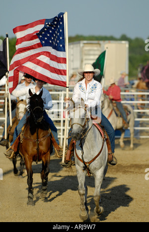 Cowboy rides Brahma bull rodeo clown follows, Brahman bull a breed of ...