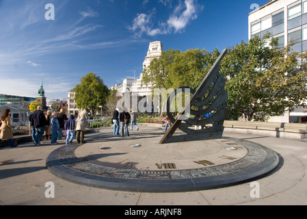 Sundial at Tower Hill Underground Station with the Tower of London in ...