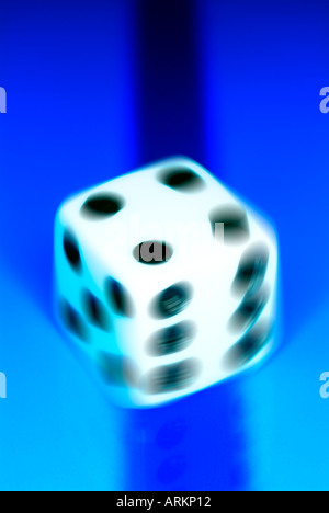 white spinning die concept image Stock Photo - Alamy