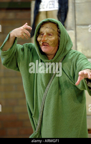 actor in mask and green cloak Stock Photo - Alamy